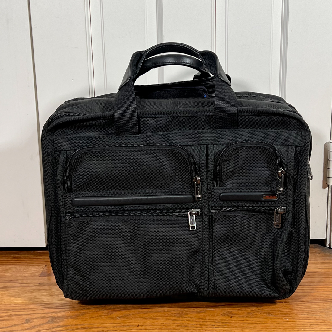 TUMI ROLLING BRIEFCASE